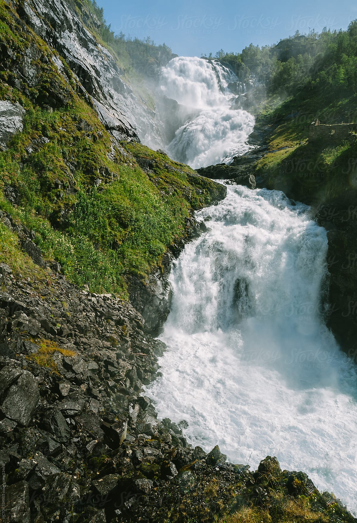 "Kjosfossen Waterfall" by Stocksy Contributor "VICTOR TORRES" - Stocksy