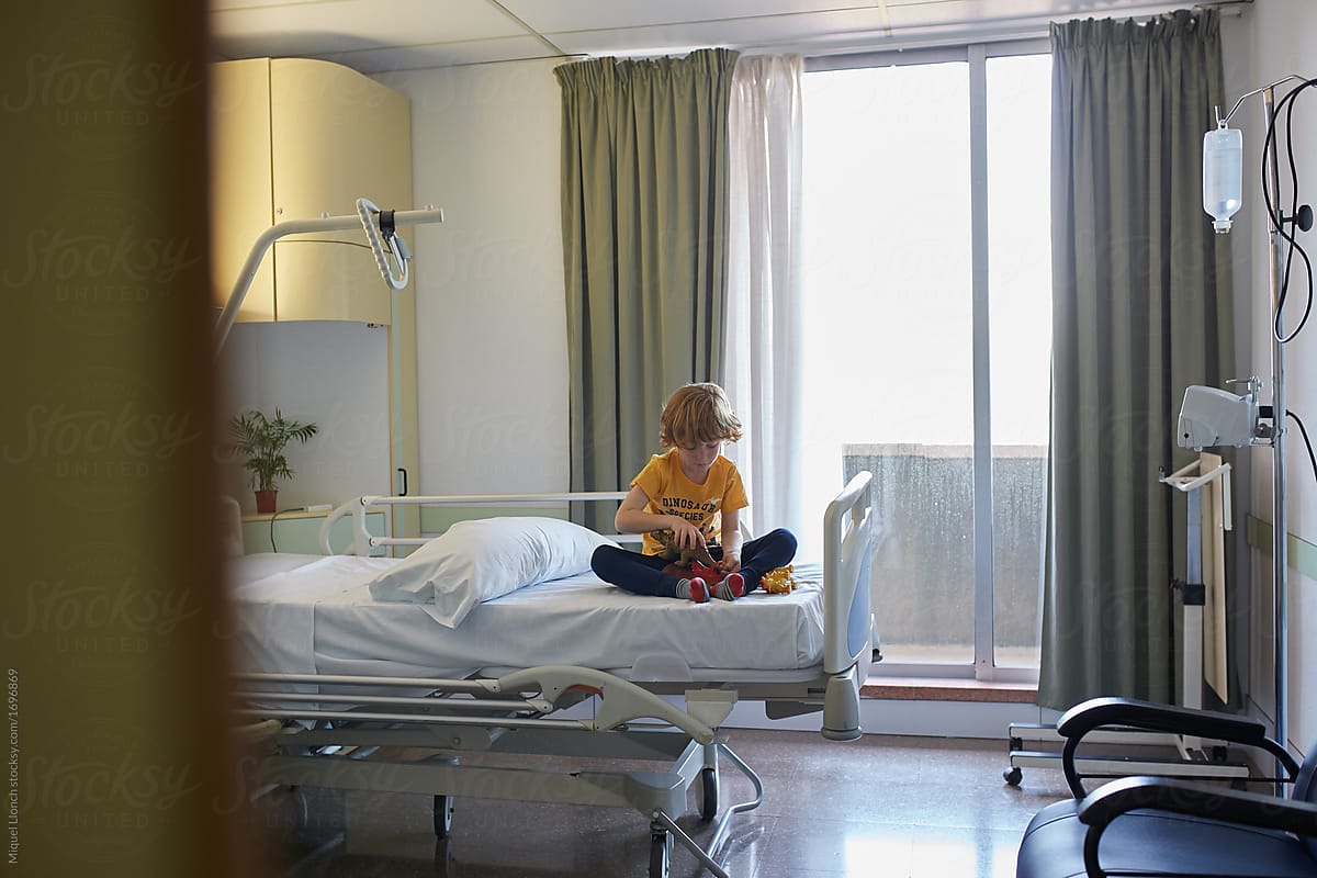 "Child Patient Playing With Toy Dinosaur In A Hospital Room" by Stocksy ...