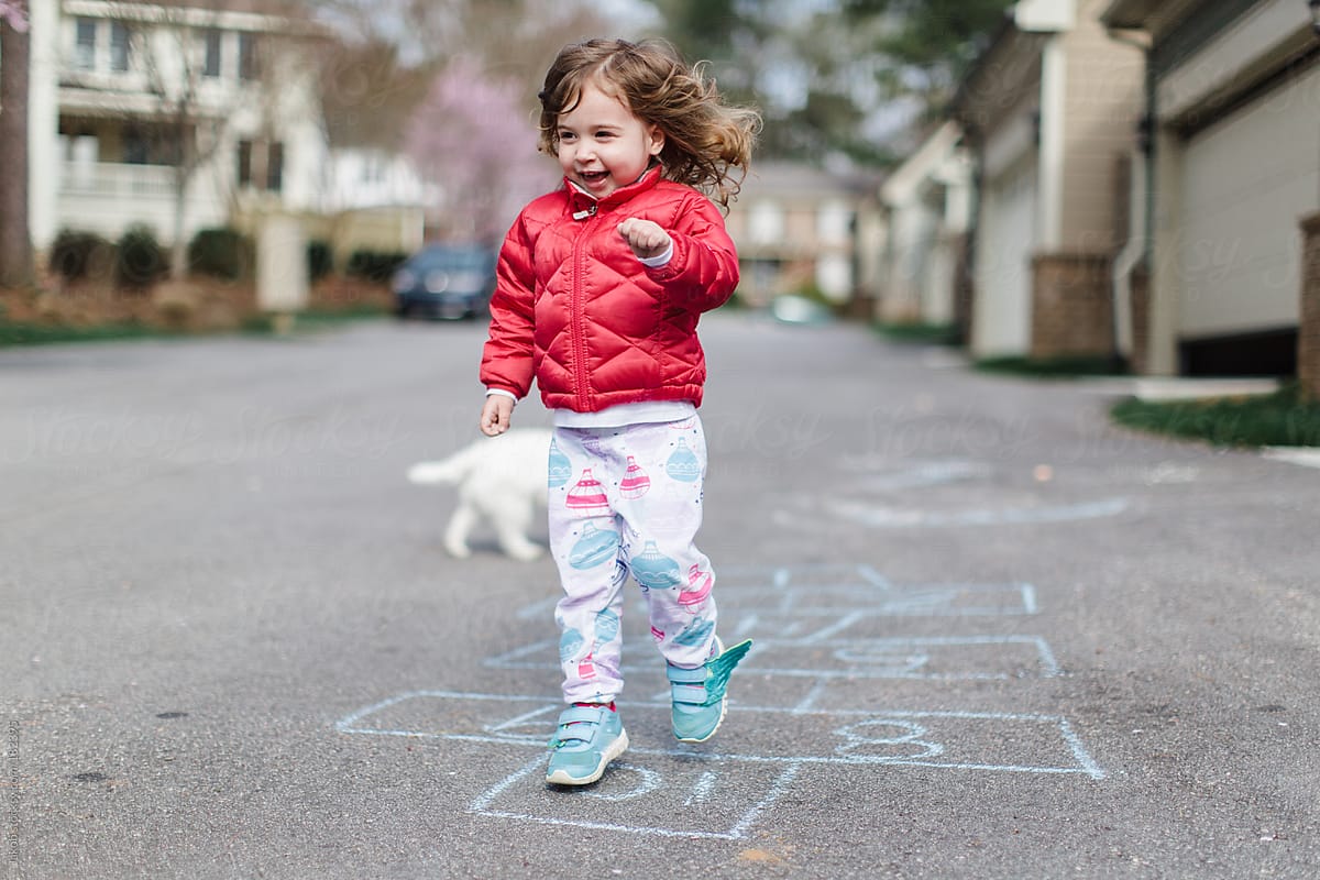 "Cute Toddler Doing Hopscotch Outside" by Stocksy Contributor "Jakob ...