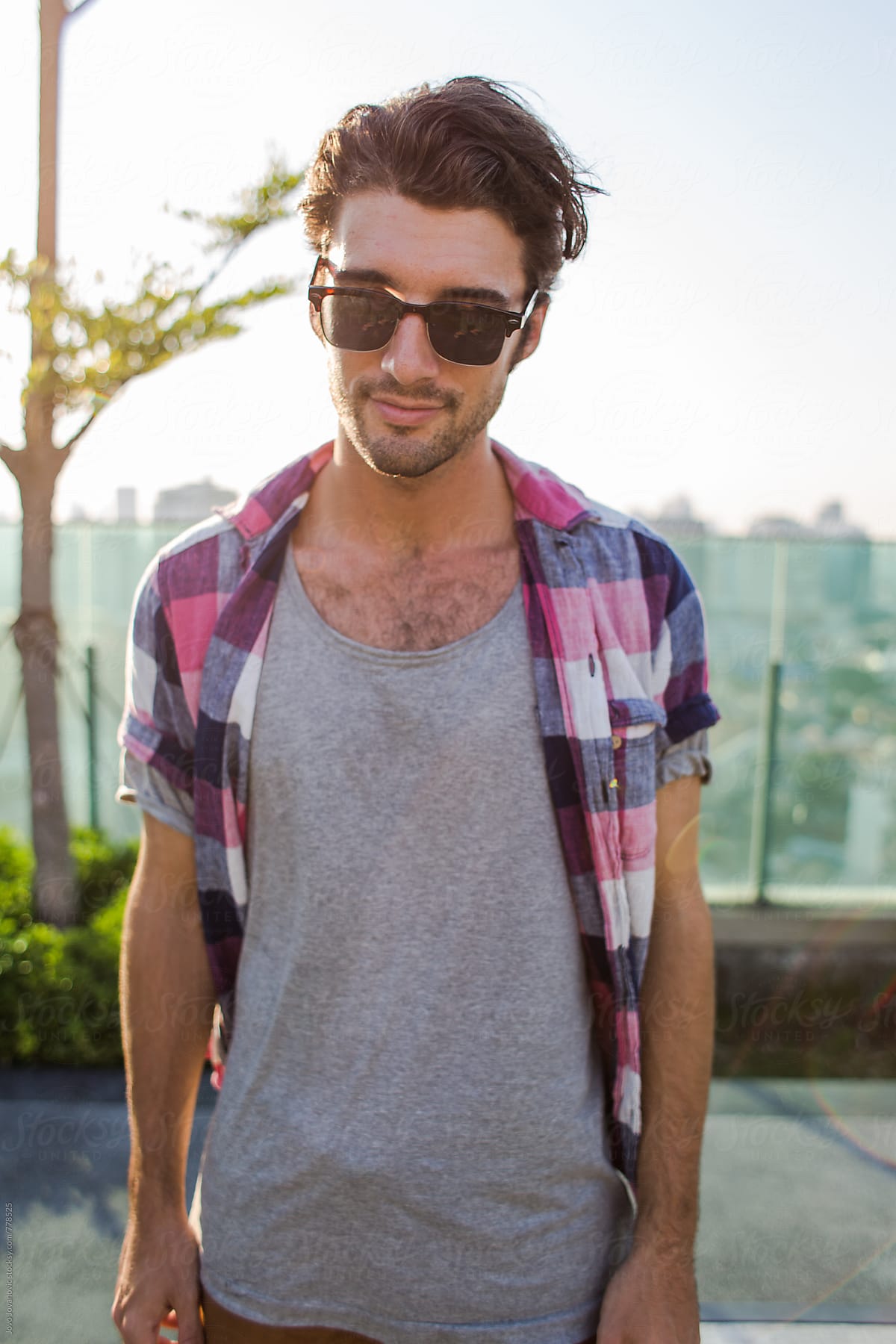 "Portrait Of A Hip Modern Man Smiling And Looking At The Camera" by ...