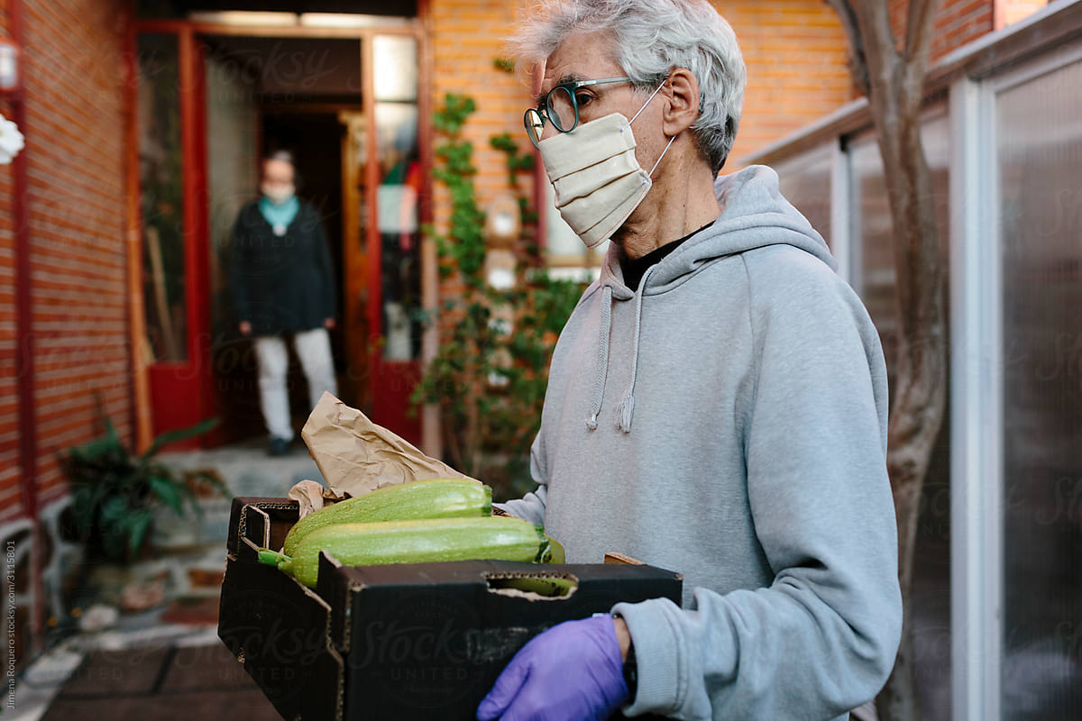 "Man Delivering Box Of Food" by Stocksy Contributor "Jimena Roquero ...