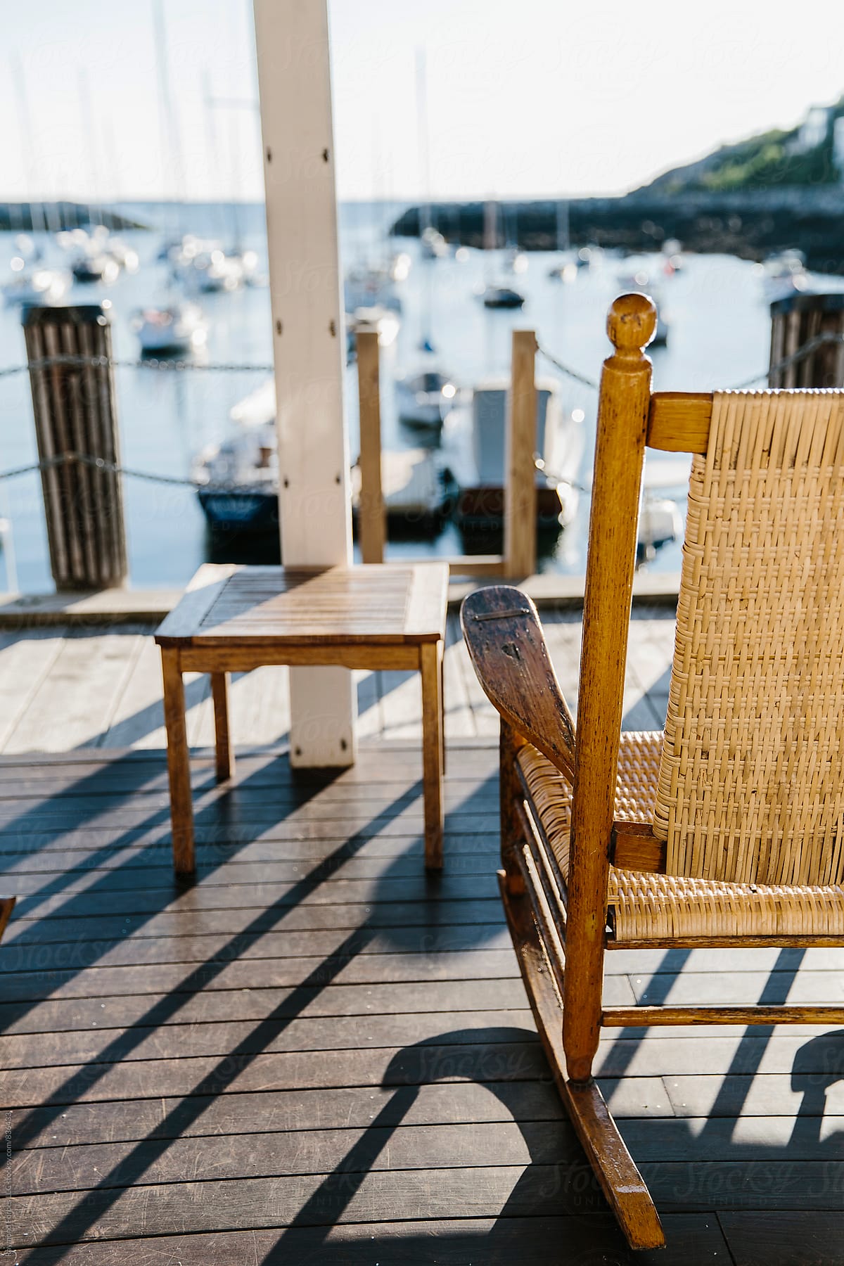 "Waterfront Rocking Chairs" by Stocksy Contributor "Raymond Forbes LLC ...