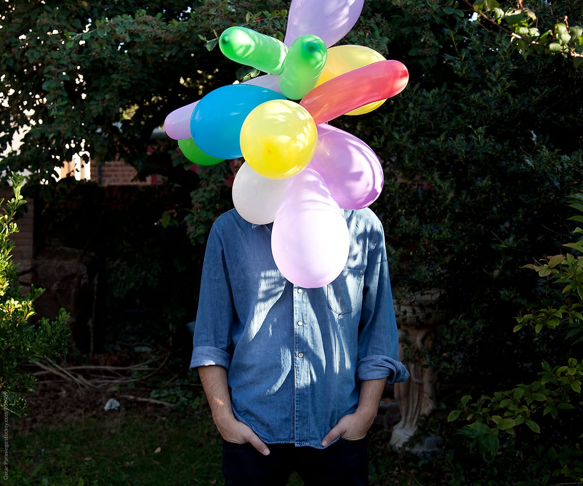 "Balloon Head Man" by Stocksy Contributor "Oscar Parasiego" - Stocksy