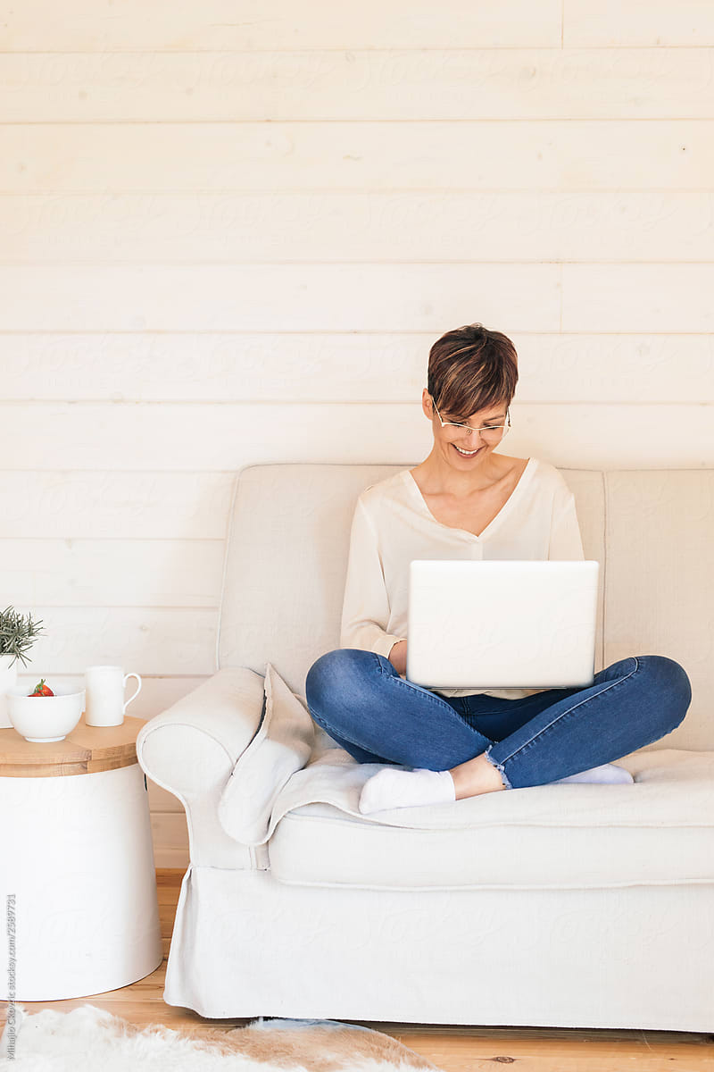 "Happy Woman Working From Home" by Stocksy Contributor "Mihajlo Ckovric ...