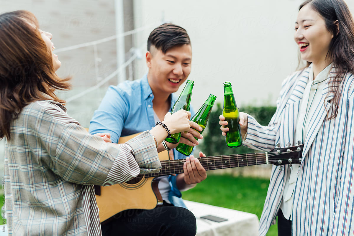 "Friends With Acoustic Guitar Singing And Drinking Beer" by Stocksy ...