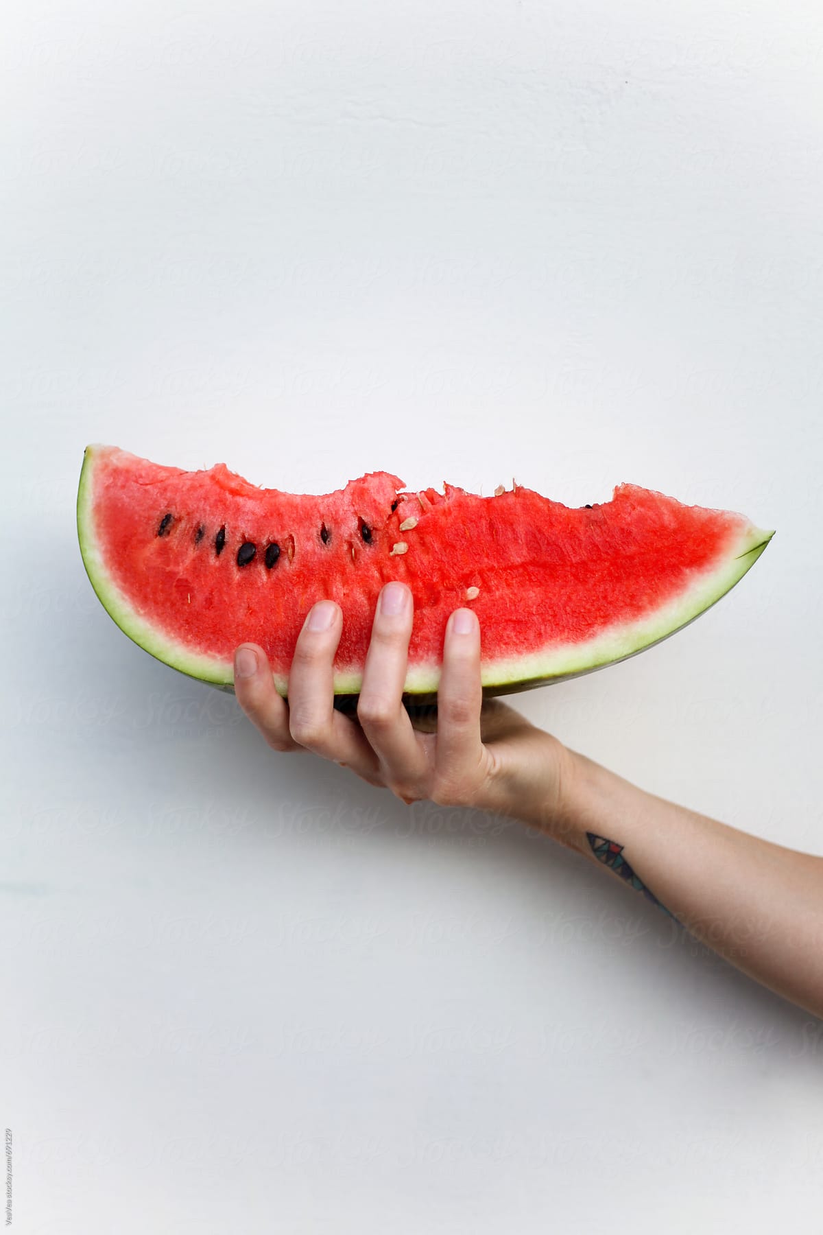 "Female Hand Holding A Slice Of Watermelon" by Stocksy Contributor ...