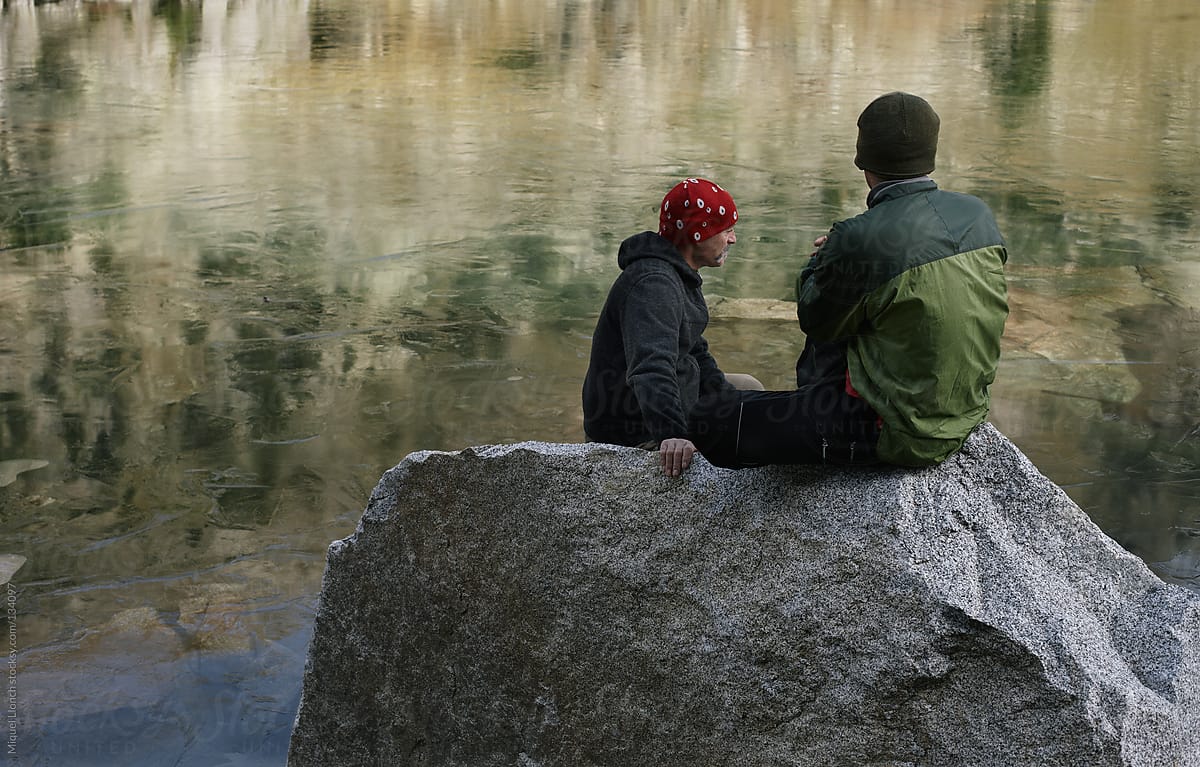 "Two Men And A Frozen Lake" by Stocksy Contributor "Miquel Llonch ...