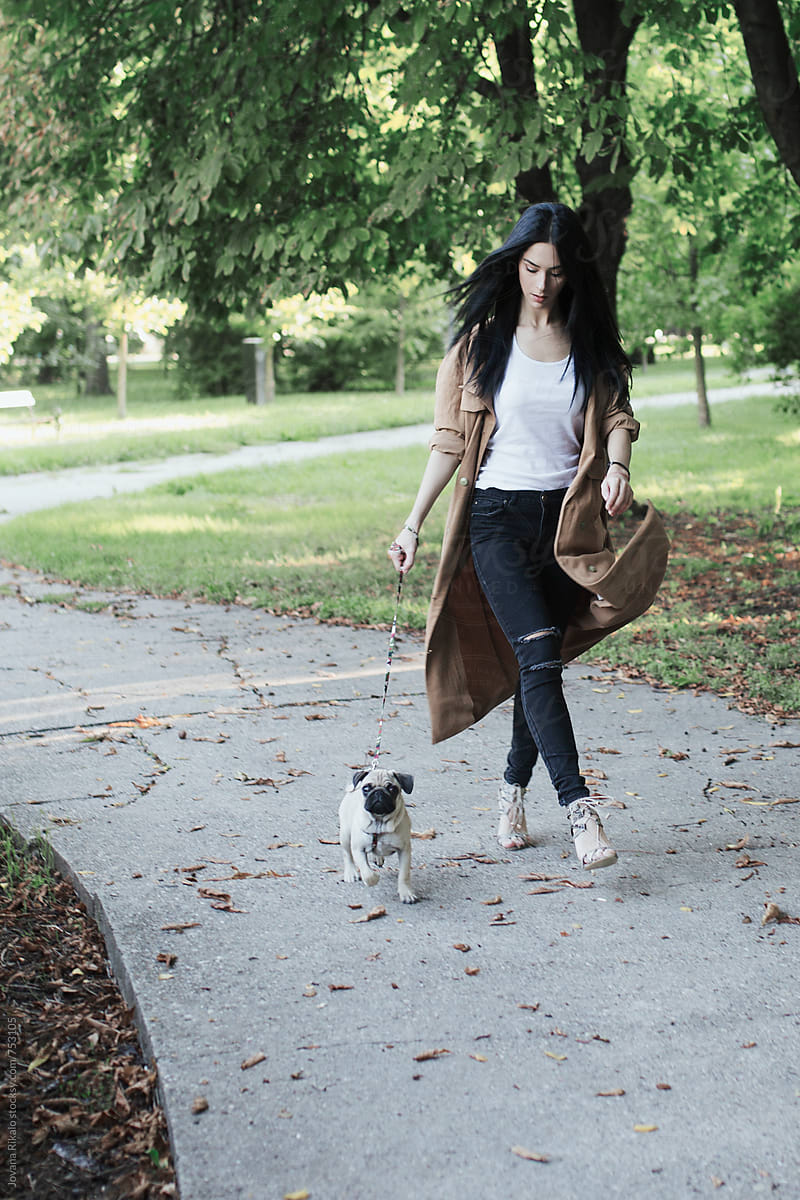 "Fashionable Young Woman And A Pug Dog" by Stocksy Contributor "Jovana ...