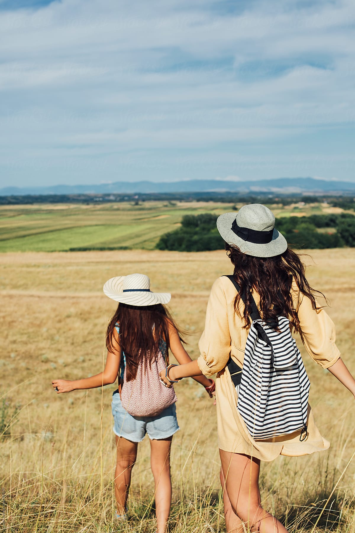 "Two Girls Hiking Together" by Stocksy Contributor "Lumina" - Stocksy