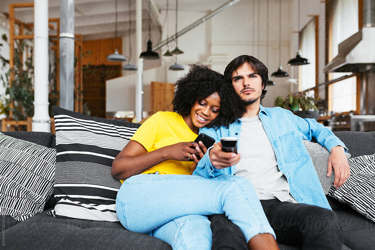 "Couple At Home." by Stocksy Contributor "BONNINSTUDIO " - Stocksy