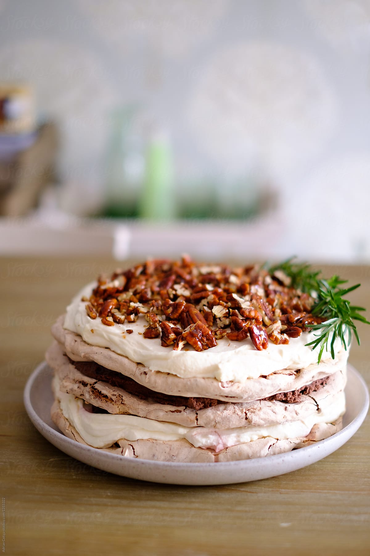 "Pecan Nuts Meringue Cake" by Stocksy Contributor "Adrian Cotiga" - Stocksy