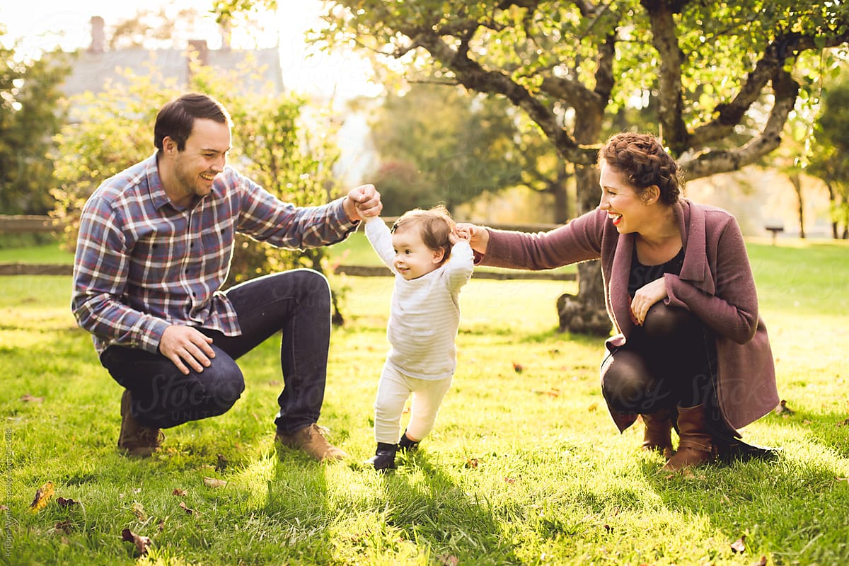 "Parents Helping Their Toddler Walk" by Stocksy Contributor "Kristine ...