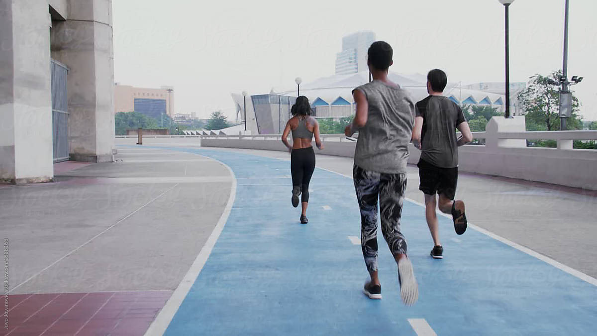 "Group Of Three Friends Running Together" by Stocksy Contributor "Jovo ...