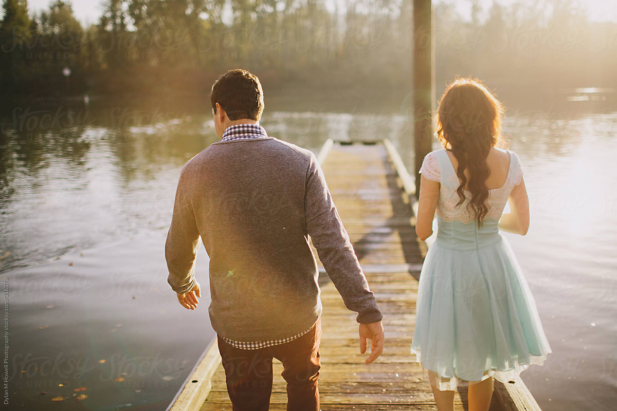 "Couple In Love On A Dock." by Stocksy Contributor "Dylan M Howell ...