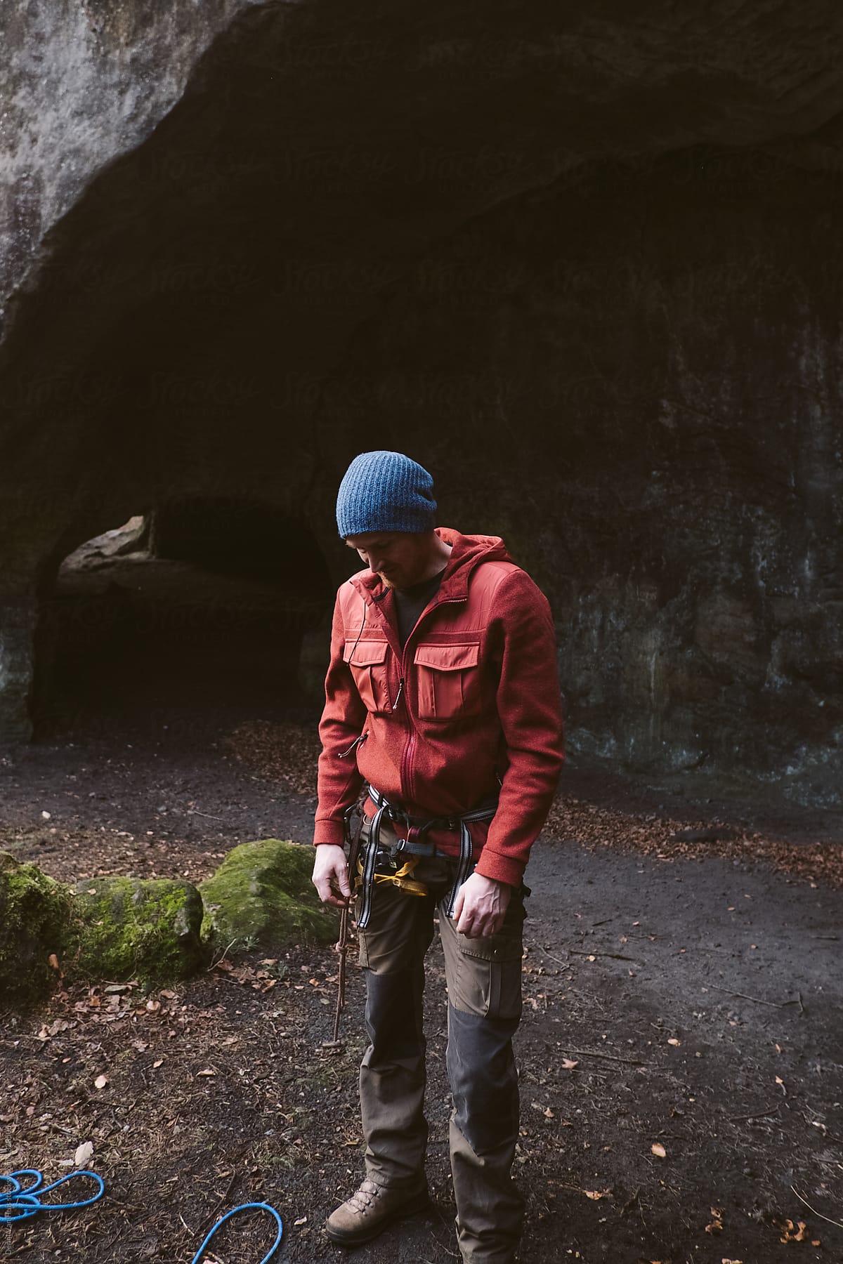 "Man Looking Down At His Climbing Rope." by Stocksy Contributor "Denni ...