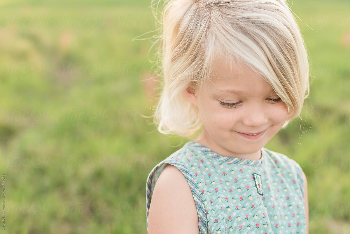 "A Shy Girl Looks Downward" by Stocksy Contributor "Alison Winterroth ...