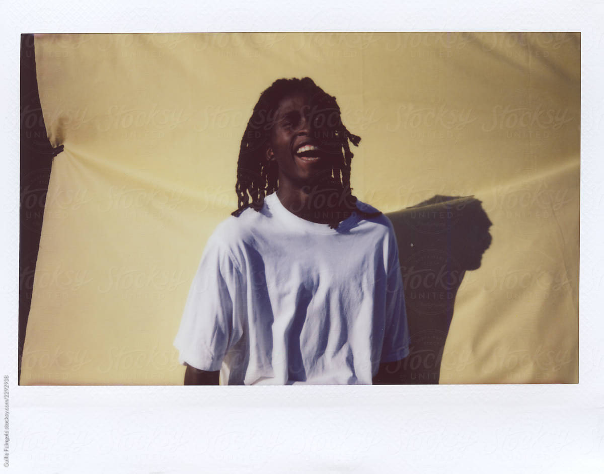 "Laughing Black Man On Instant Photo" by Stocksy Contributor "Guille ...