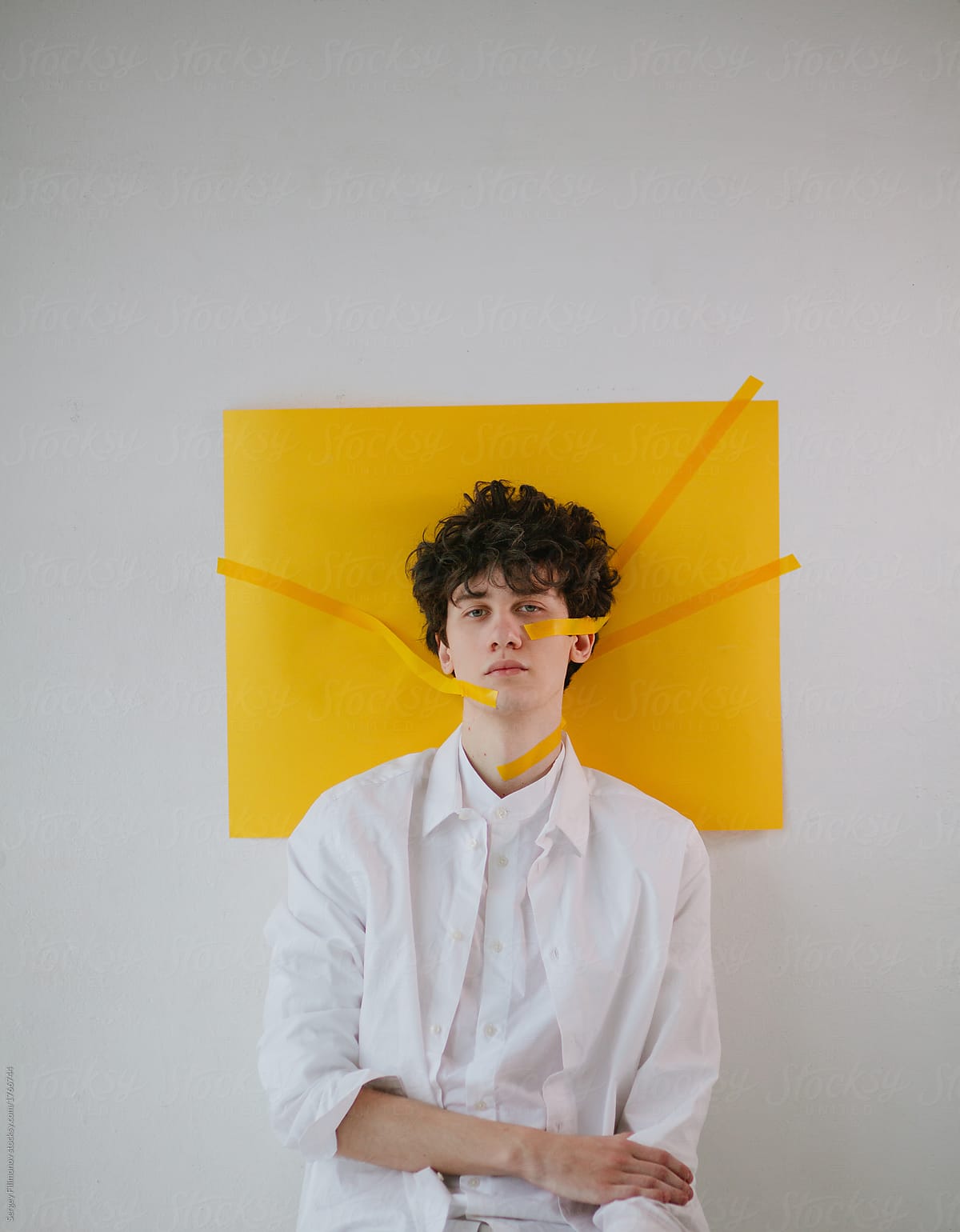 "Man In White Taped To Wall" by Stocksy Contributor "Serge Filimonov ...