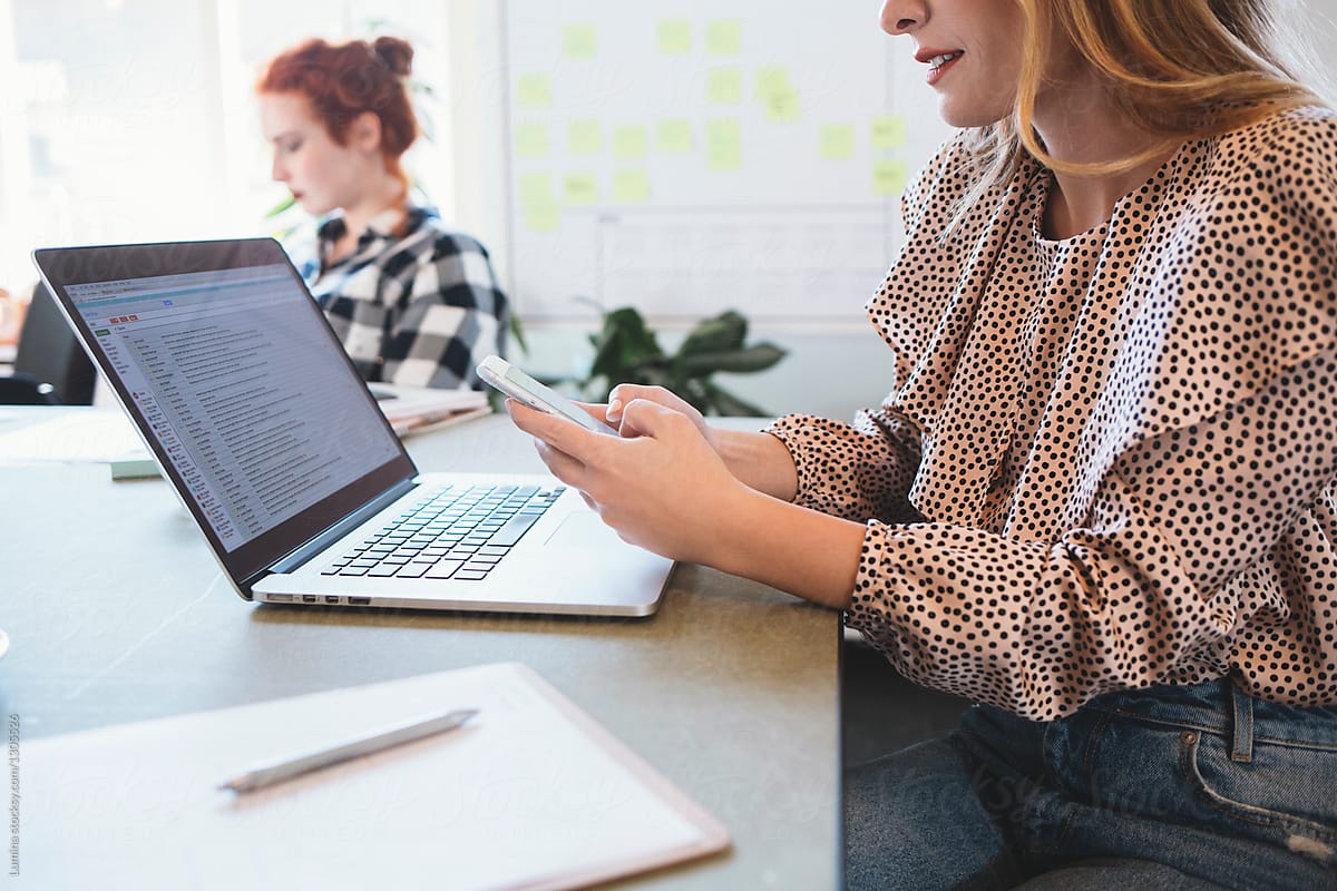 "Businesswoman Typing On Her Cell Phone" by Stocksy Contributor "Lumina ...