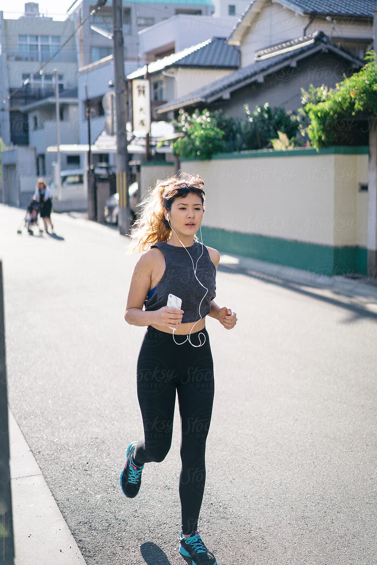 "Fit Asian Woman Jogging In A City" by Stocksy Contributor "Studio ...