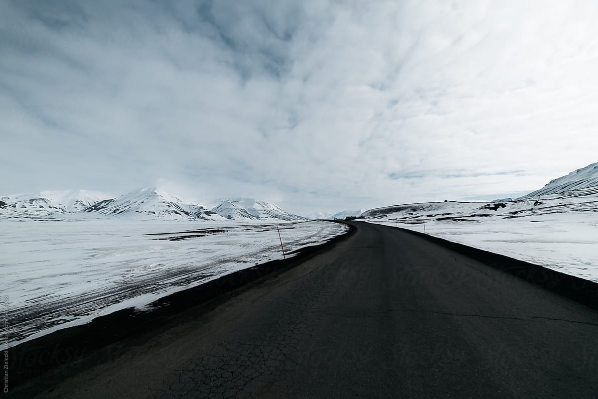 "Asphalt Road Near Snowy Mountain Ridge" by Stocksy Contributor "Chris ...