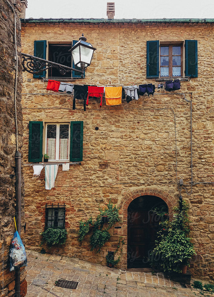"Laundry Drying On Washing Line Against Old Brick Building In Medieval ...