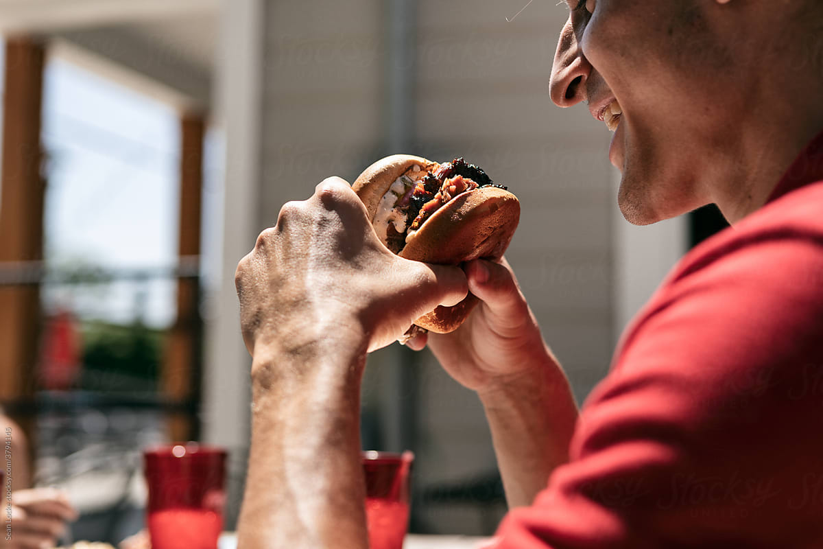 "BBQ: Man Eating Huge Smoked Brisket Sandwich" by Stocksy Contributor ...