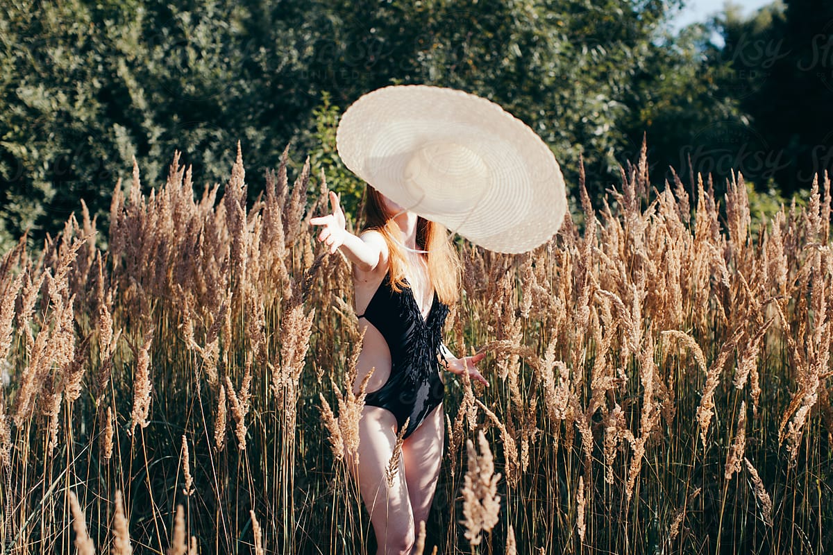 "Anonymous Woman Throwing Her Hat At Camera" by Stocksy Contributor ...