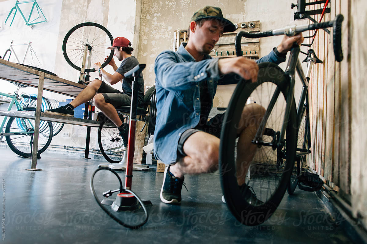 "Two Employees In Trendy Bike Shop" by Stocksy Contributor ...