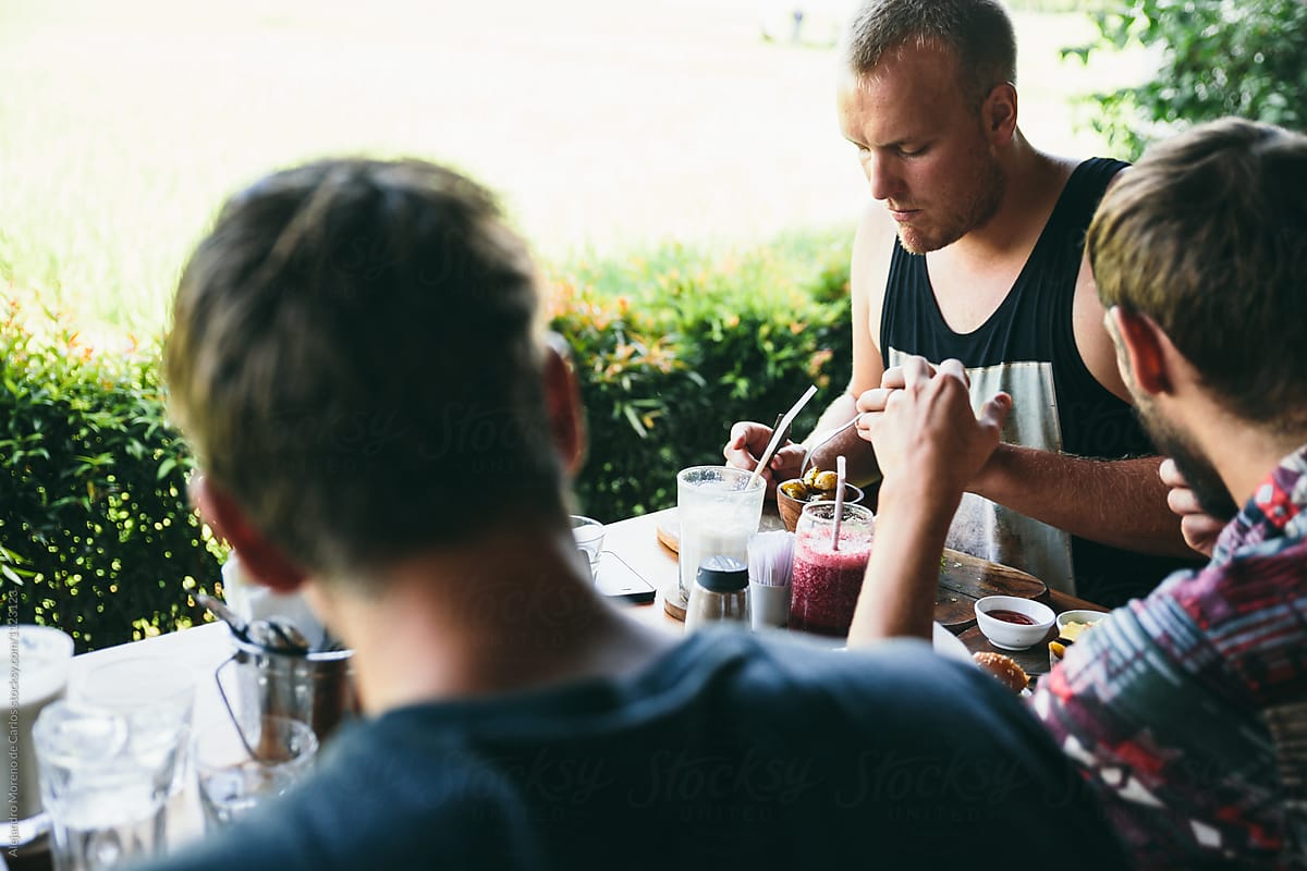"Group Of Men Having Breakfast At Outdoor Cafe" by Stocksy Contributor ...