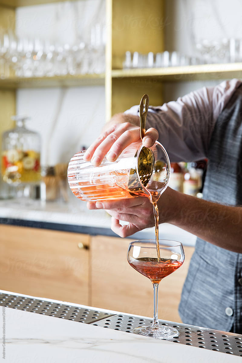 "Bartender Pouring Cocktail" by Stocksy Contributor "Andrew Cebulka ...