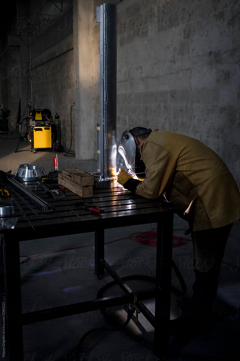 "Welder At Work In His Workshop" by Stocksy Contributor "Mauro Grigollo ...