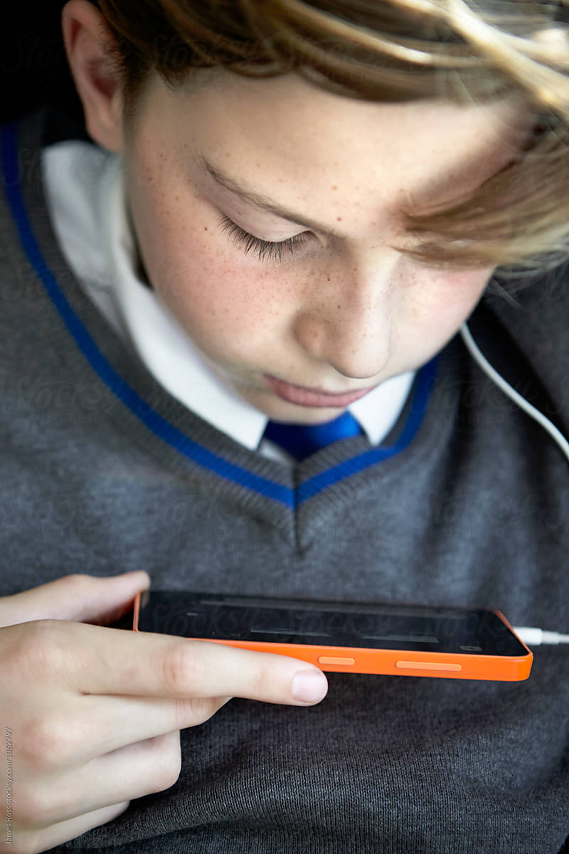 "Teenage Boy Relaxing With His Mobile Phone" by Stocksy Contributor ...