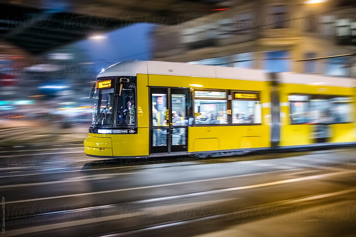 "Yellow Tram Moving Fast In Berlin" by Stocksy Contributor "koganami ...