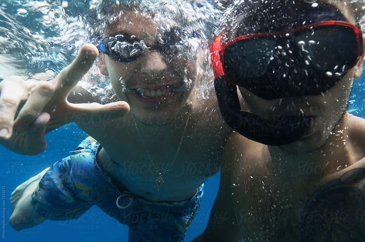 "Friends Having Fun Underwater" by Stocksy Contributor "Milles Team ...