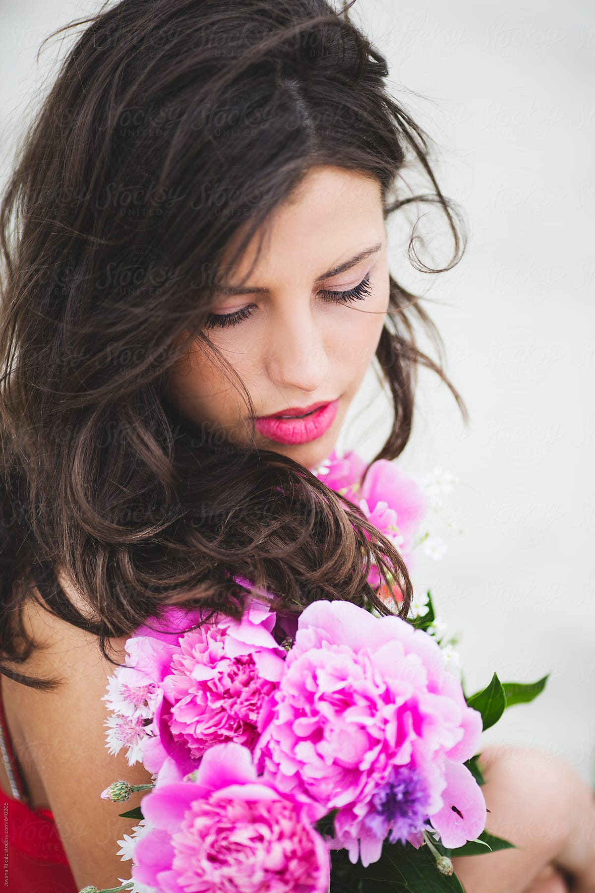 "Young Woman With Peonies" by Stocksy Contributor "Jovana Rikalo" - Stocksy