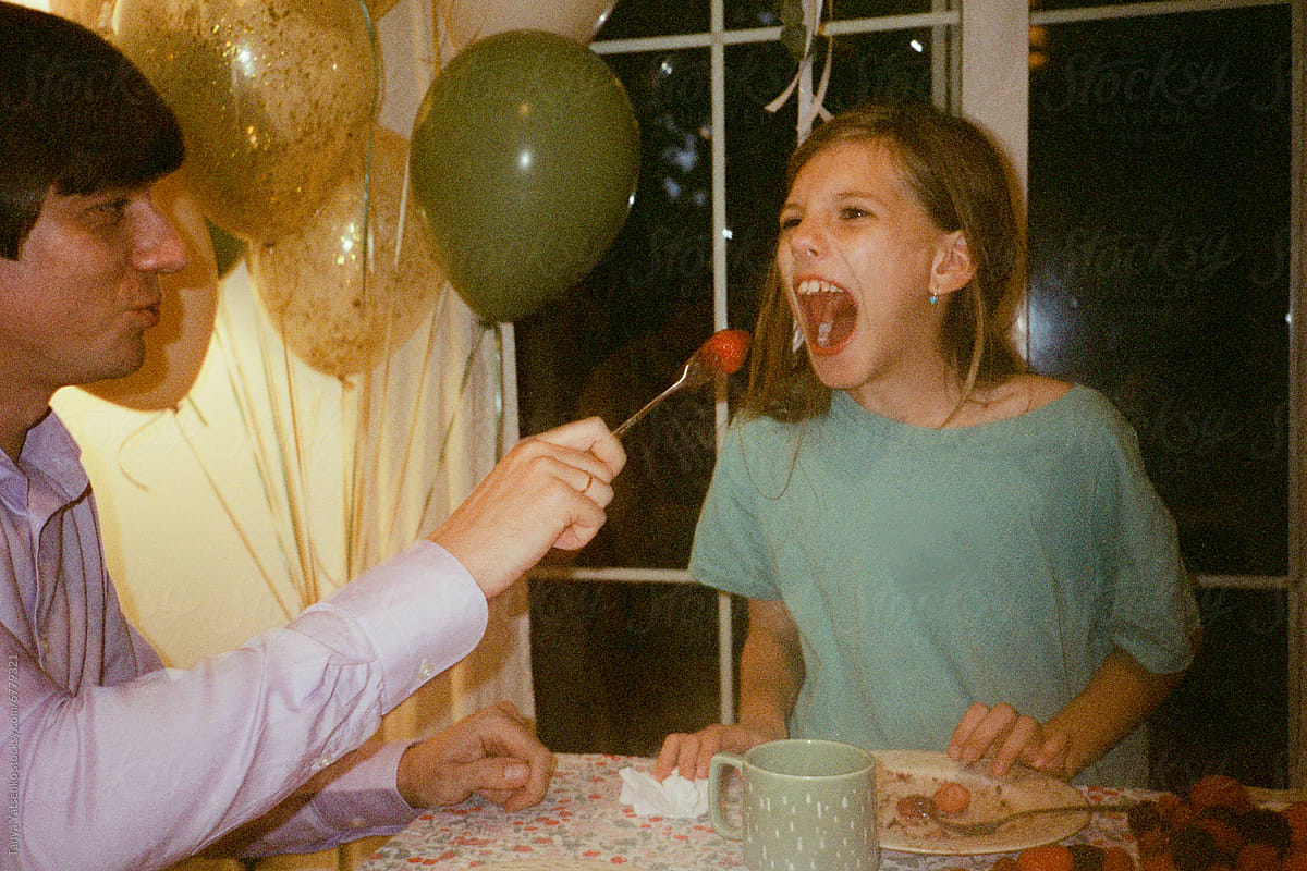 "Father Giving A Strawberry To His Daughter" by Stocksy Contributor ...