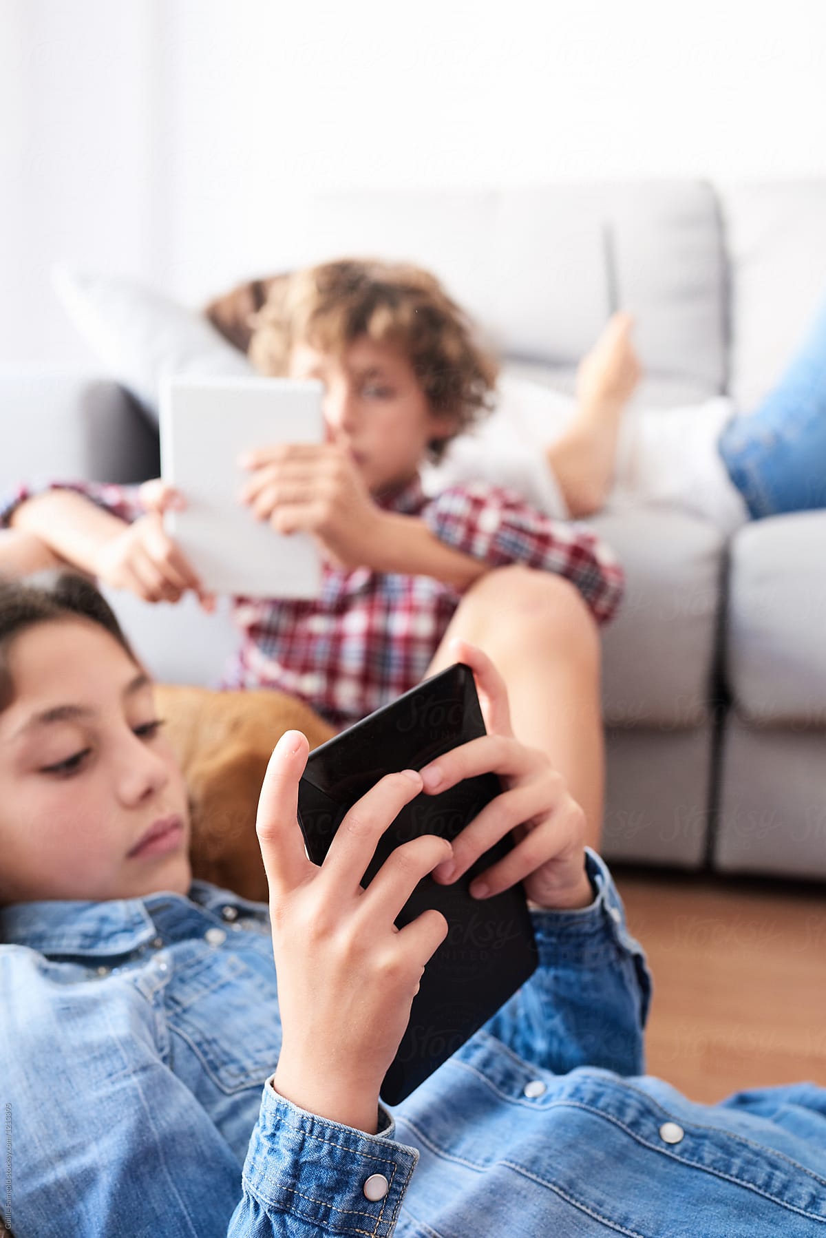"Children Using Gadgets." by Stocksy Contributor "Guille Faingold ...