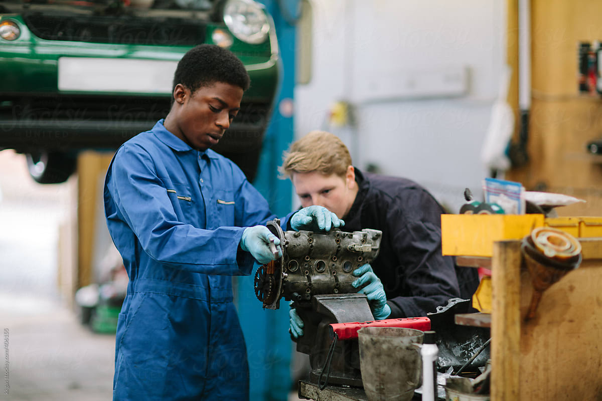 "Two Apprentice Mechanics" by Stocksy Contributor "kkgas" - Stocksy