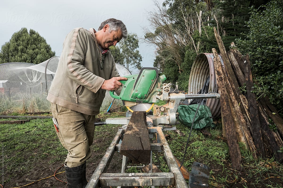 "Handyman Using Circular Saw" by Stocksy Contributor "Rowena Naylor ...