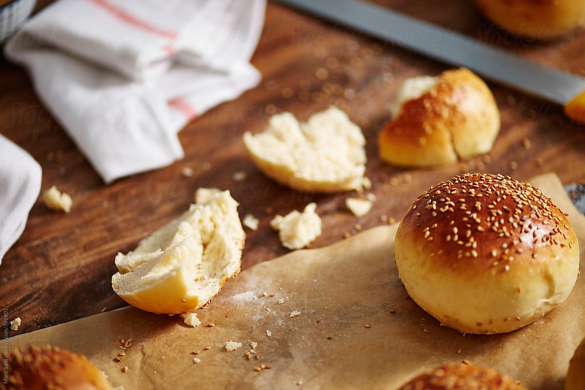 "Sliced Homemade Burger Buns" by Stocksy Contributor "Martí Sans" - Stocksy
