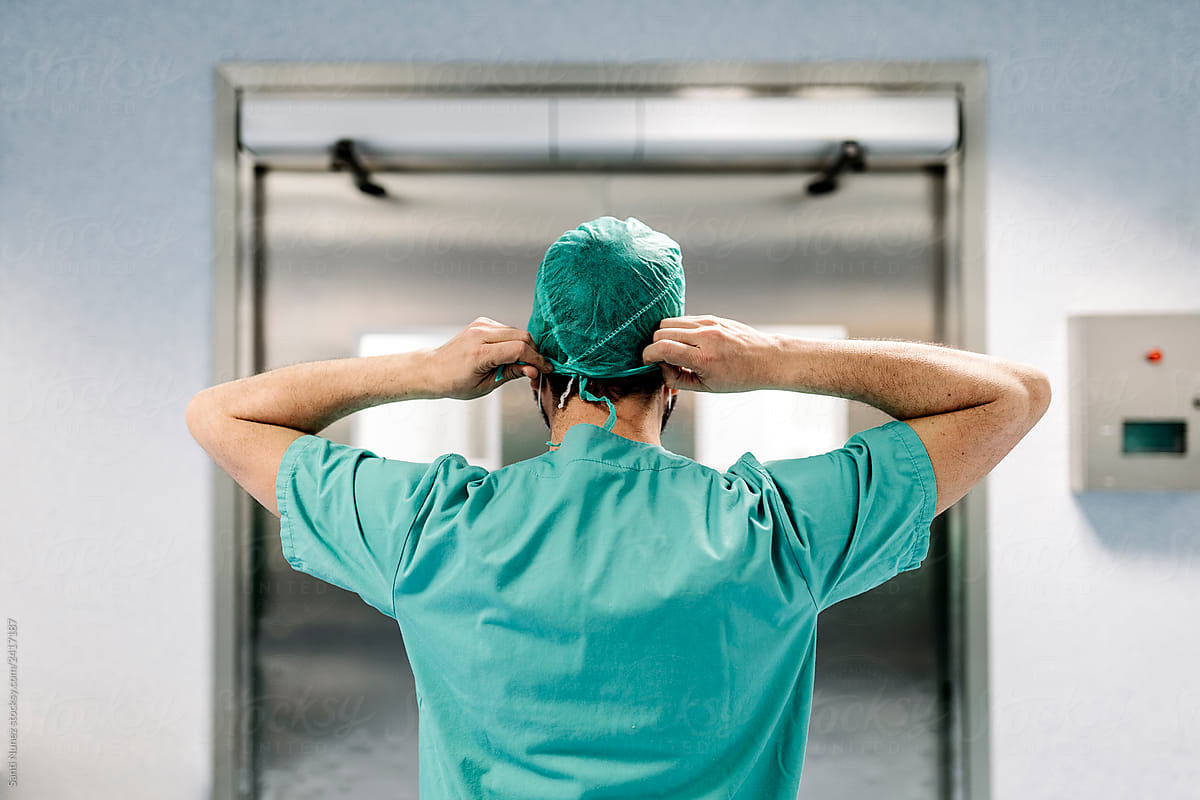 "Unrecognizable Doctor Covering His Face With Mask" by Stocksy ...