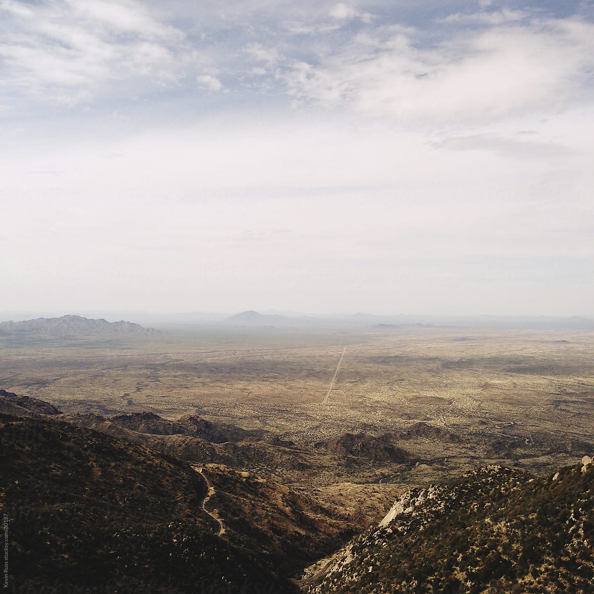 "Windy Mountain Desert Road" by Stocksy Contributor "Kevin Russ" - Stocksy