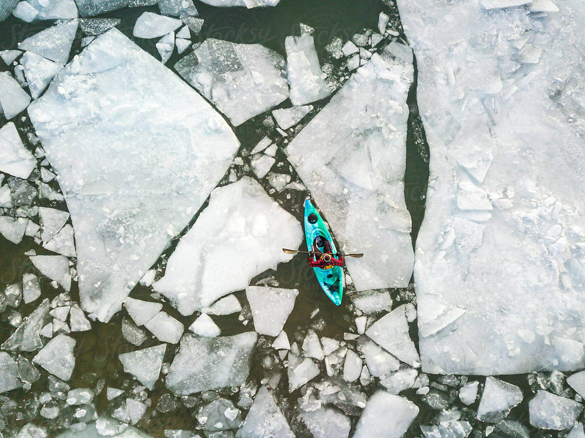 "Aerial View Of Kayaker Navigating Through Lake Ice" by Stocksy ...