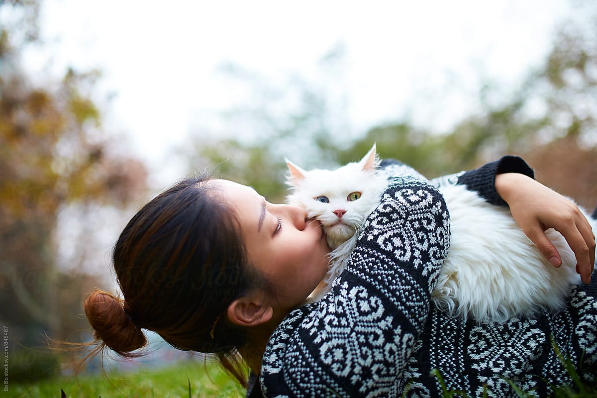"Happy Young Asian Woman With Her Cat Outdoor" by Stocksy Contributor ...