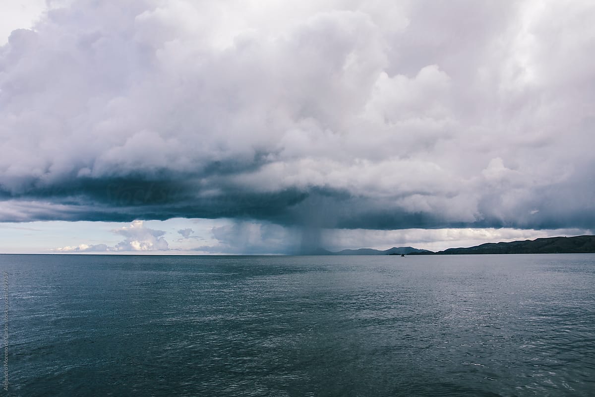 "Rain Storm And Clouds Over Lake" by Stocksy Contributor "Alejandro ...