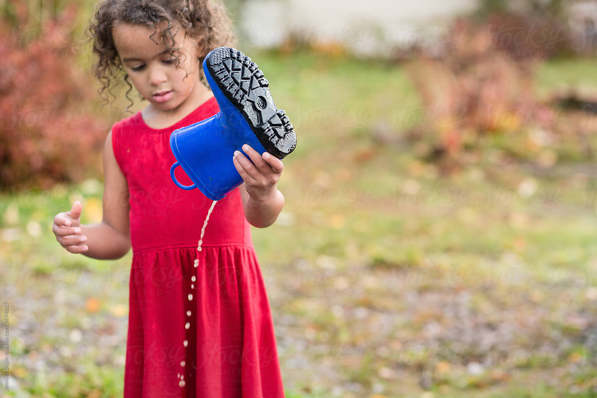"Girl Pours Water Out Of Boot" by Stocksy Contributor "Jennifer Bogle ...