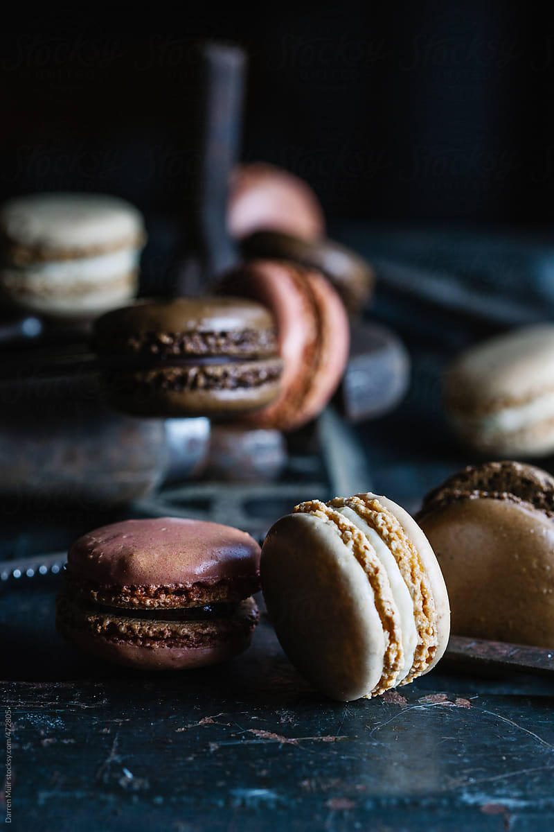 "Macaroons On Table." by Stocksy Contributor "Darren Muir" - Stocksy