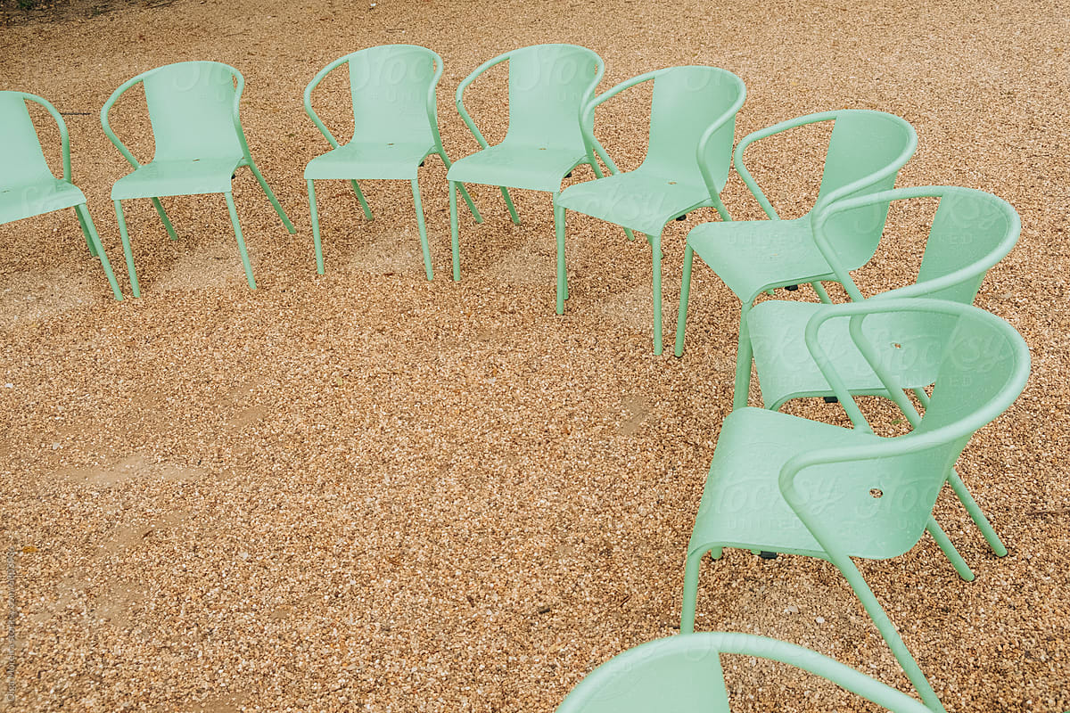 "Green Metal Chairs Arranged In A Circle" by Stocksy Contributor "Olga ...