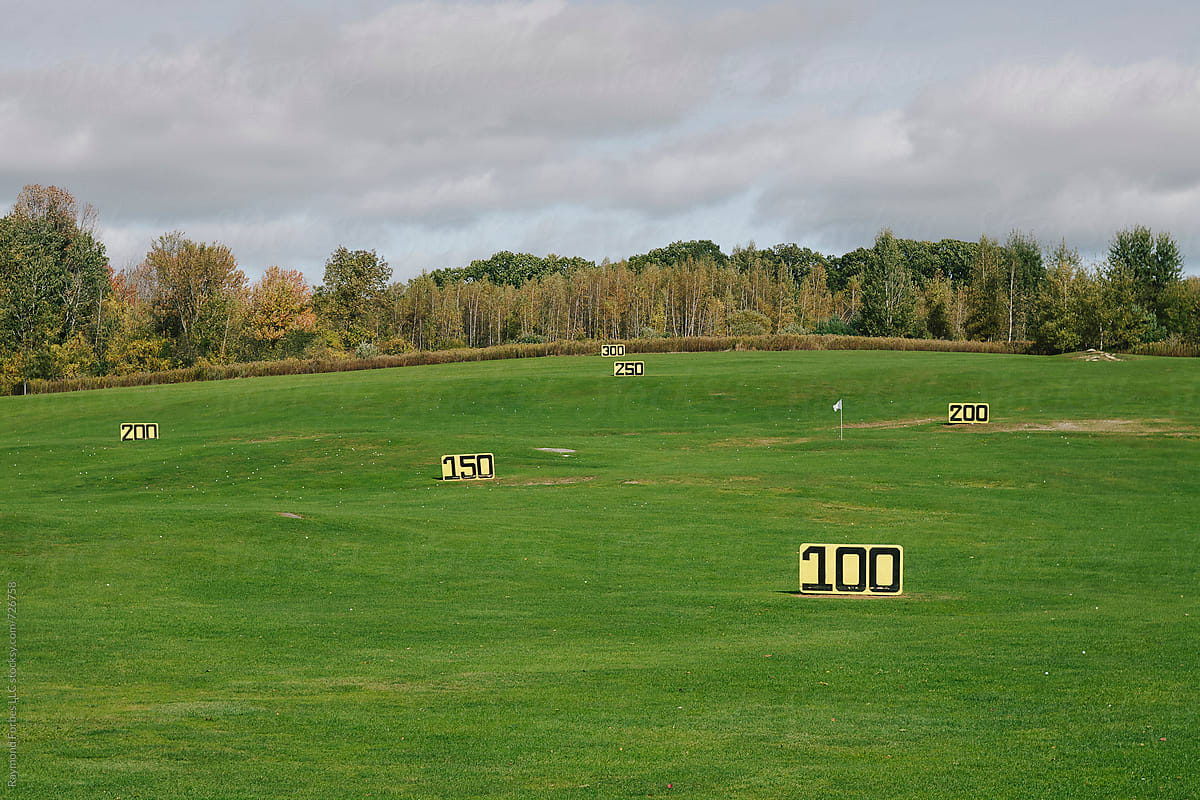 "Golf Practice Range" by Stocksy Contributor "Raymond Forbes LLC" - Stocksy